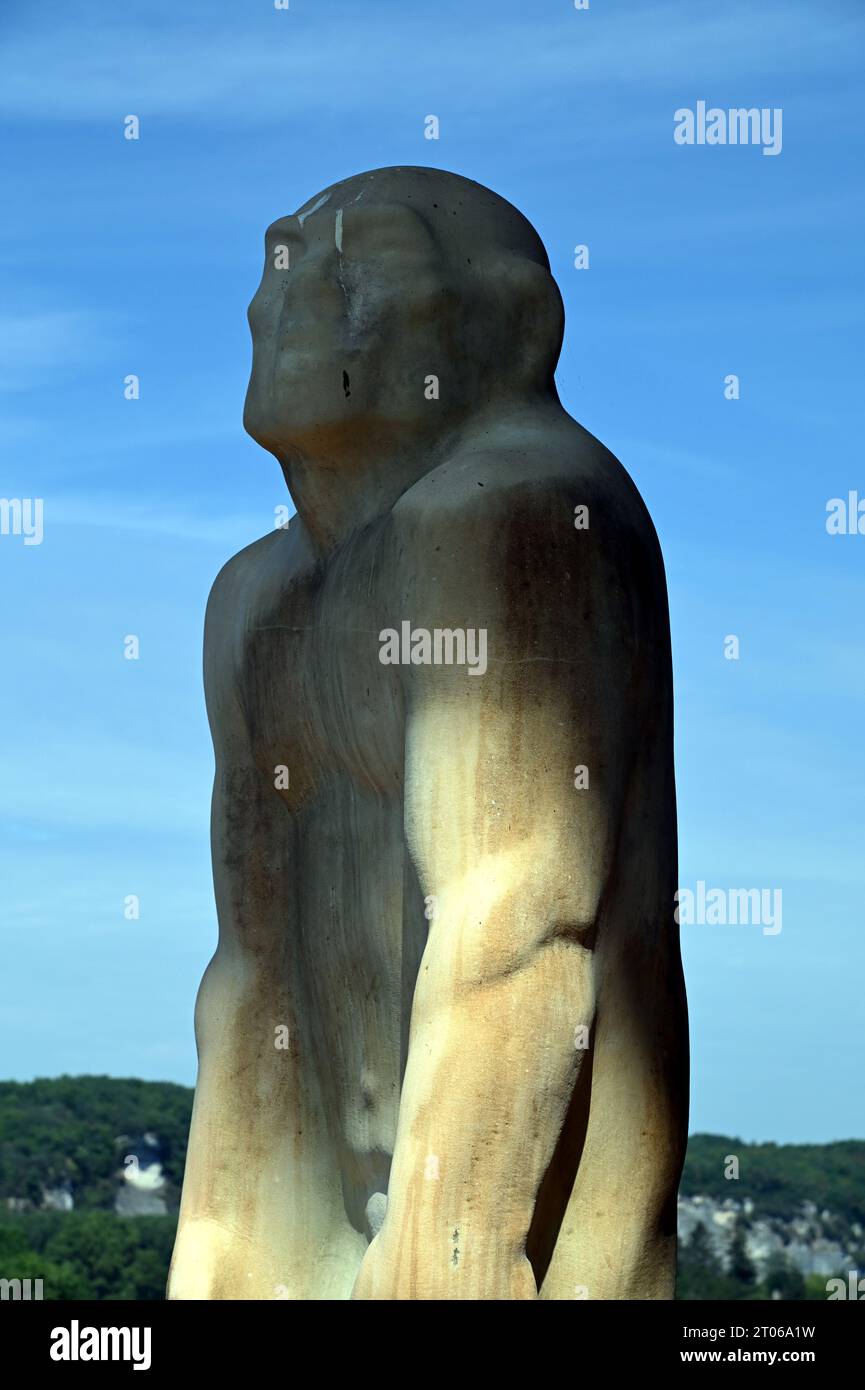 The statue of Cro Magnon Man looks out over the Dordogne river and ...