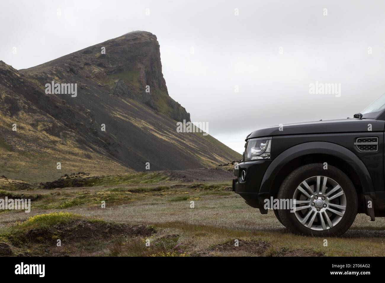 Traveling by off-road 4wd car in Iceland. Black car parked on the grass ...