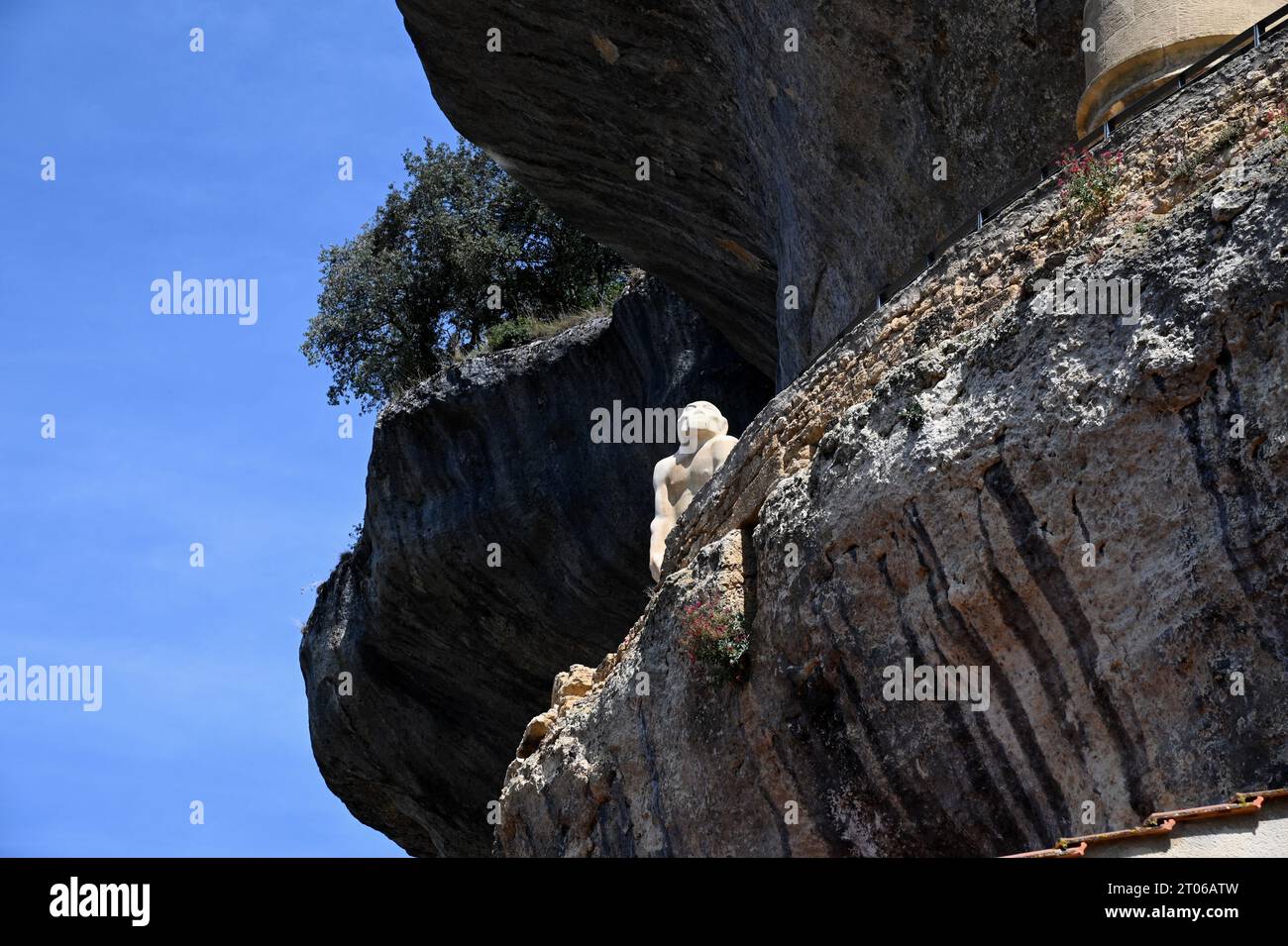 The statue of Cro Magnon Man looks out over the Dordogne river and ...