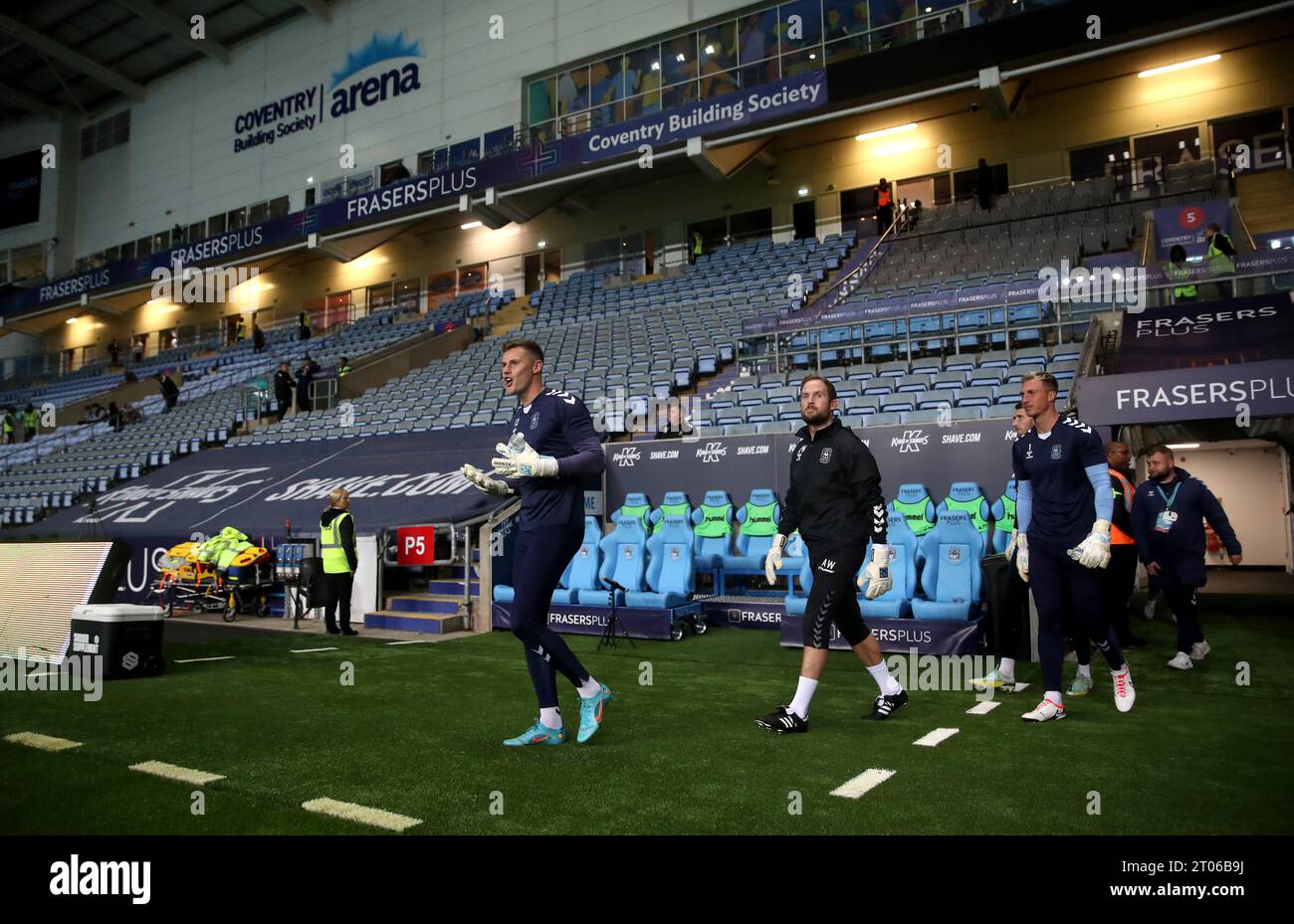 Coventry City goalkeeper Ben Wilson (left) heads out for the warm-up ...