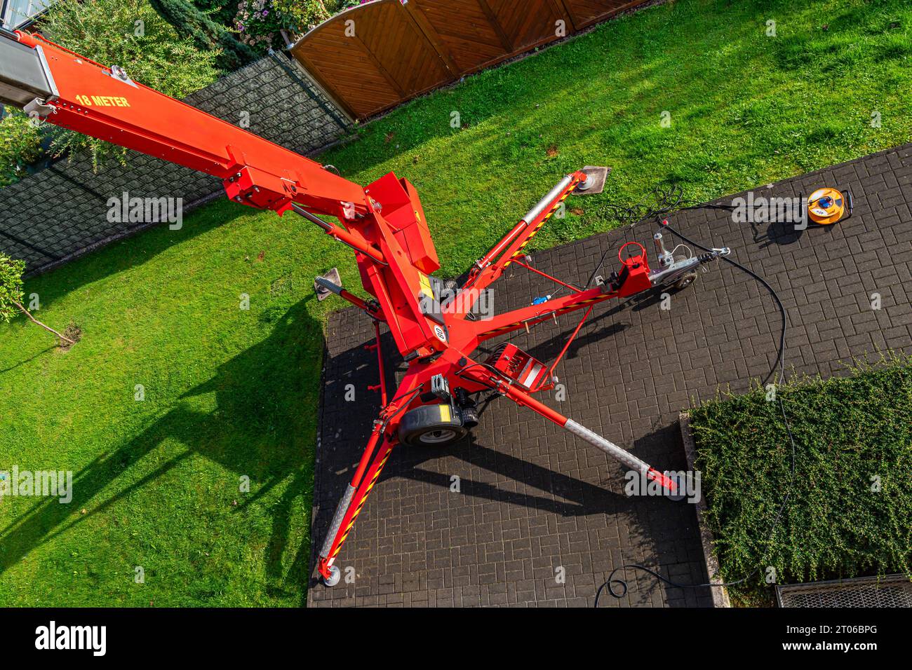 Top view of the supports of a red lift for building renovation standing ...