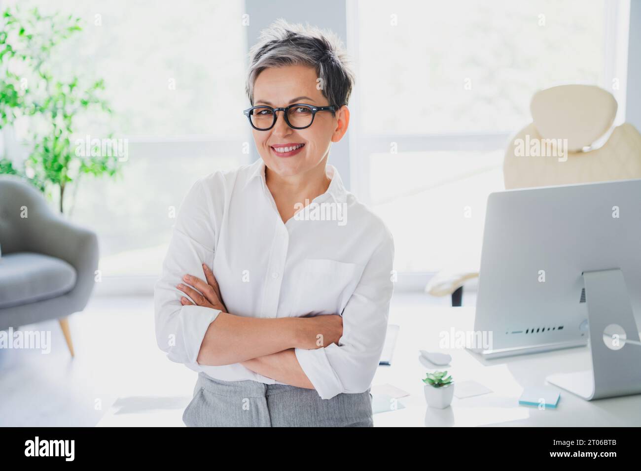 Photo of cheerful positive lady boss wear white shirt smiling arms ...