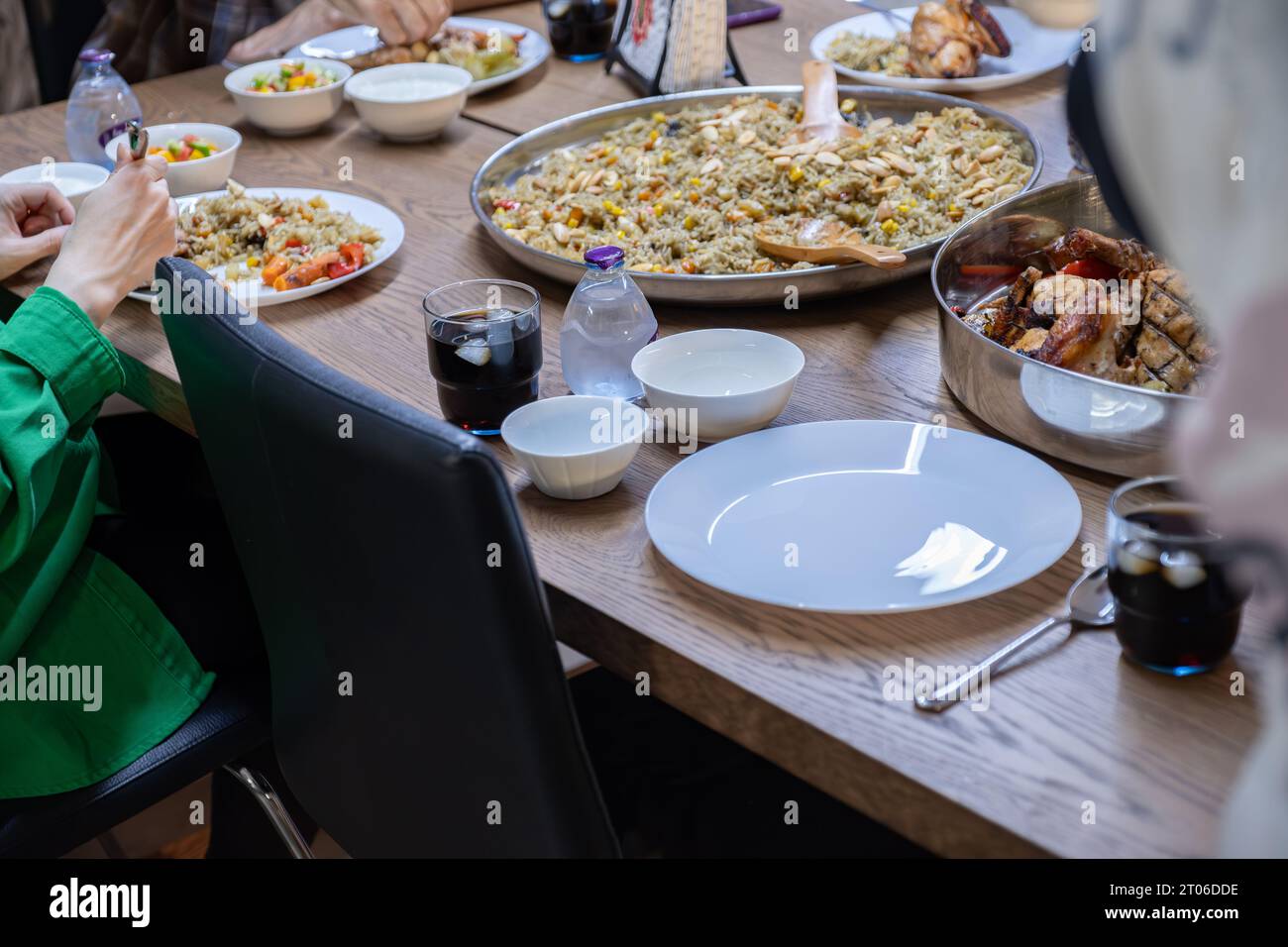 Woman table during family dinner hi-res stock photography and images ...