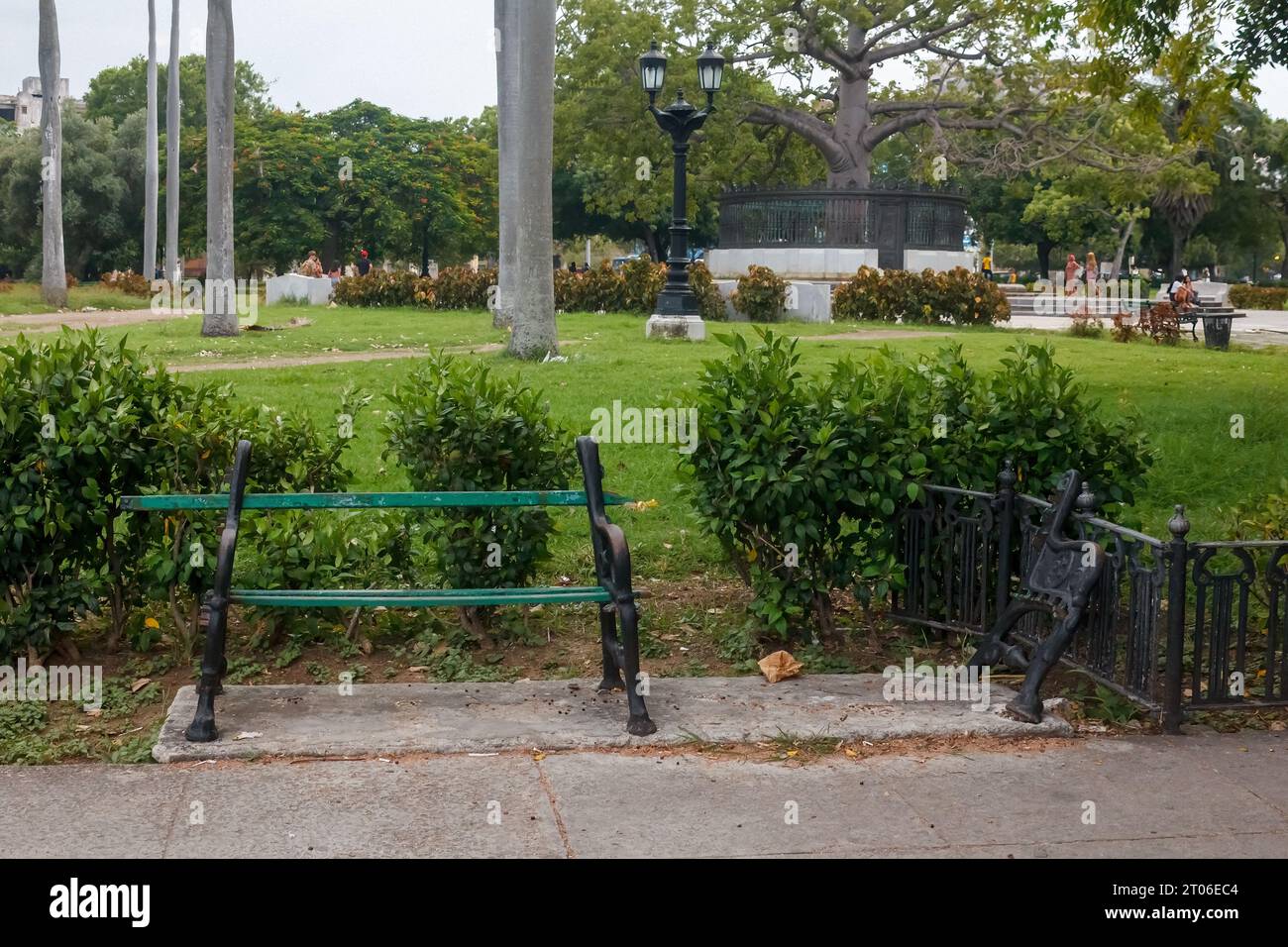 A broken bench in Central Park or Parque Central. The square is a ...