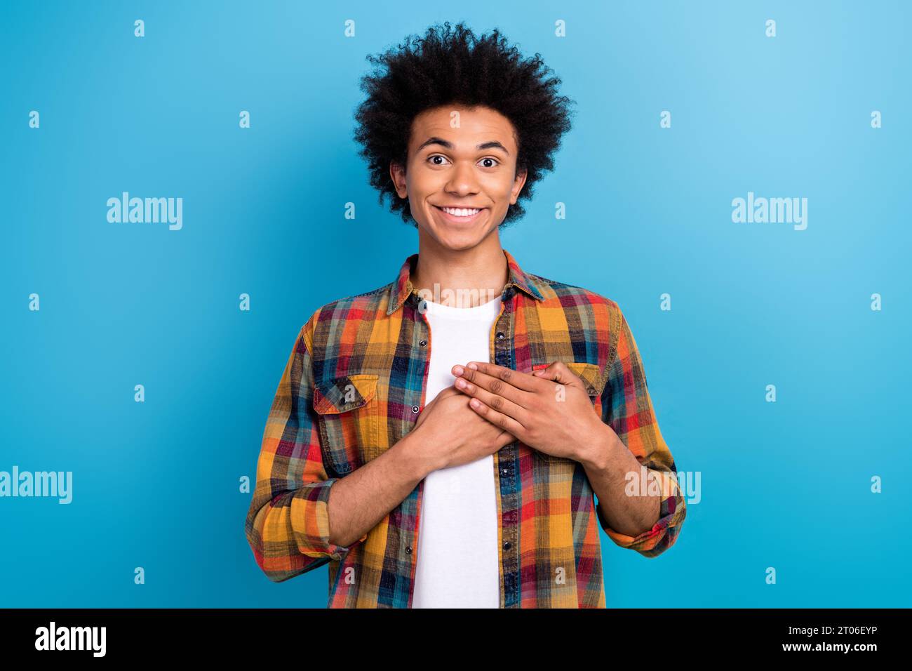 Photo of good mood sincere guy wear plaid shirt arms chest smiling ...