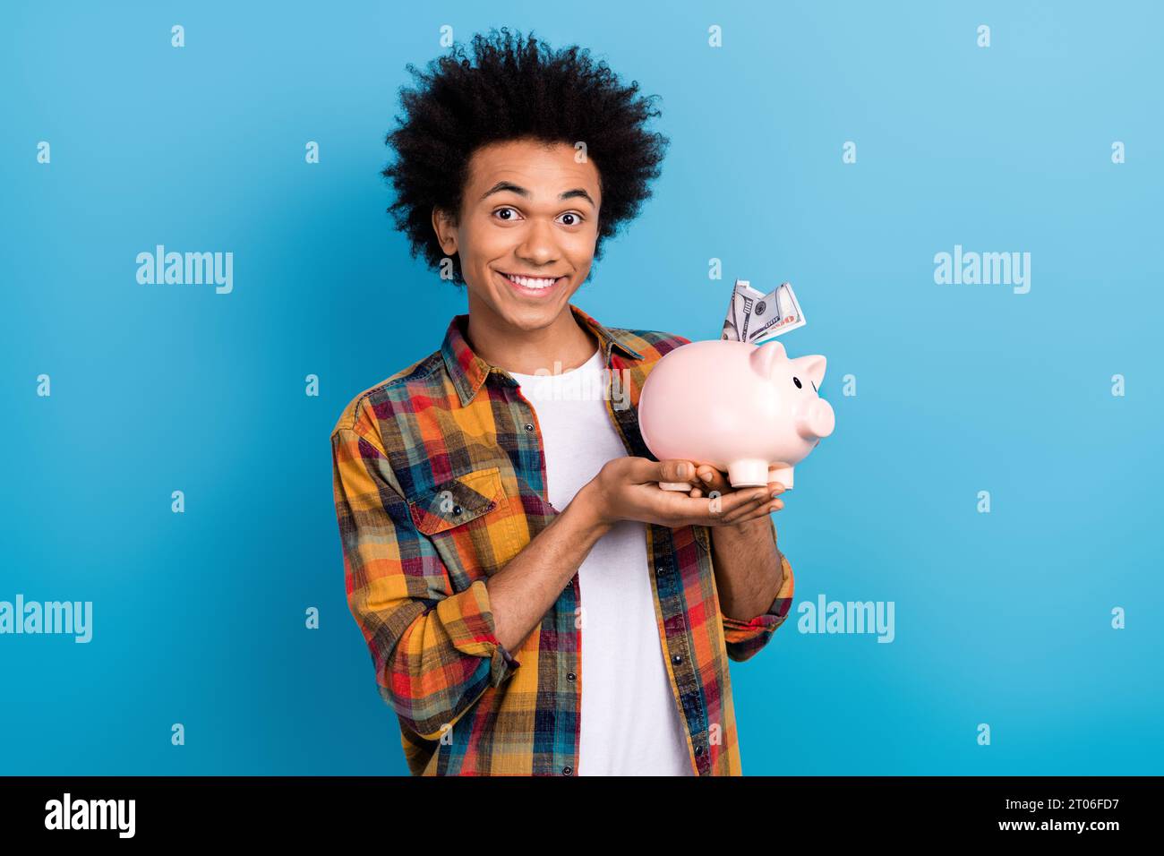 Portrait of cheerful smart guy with perming coiffure dressed plaid ...