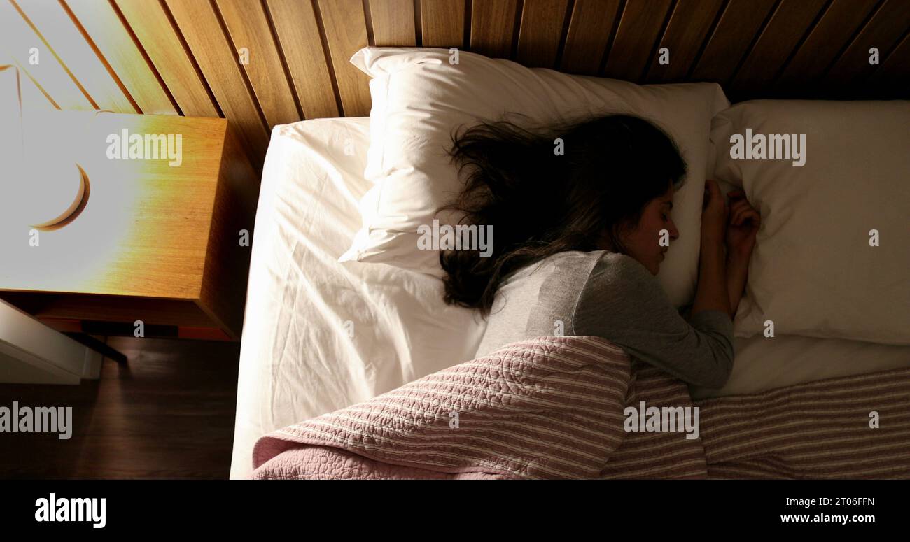 Worried woman unable to sleep suffering from insomnia. Person tossing ...