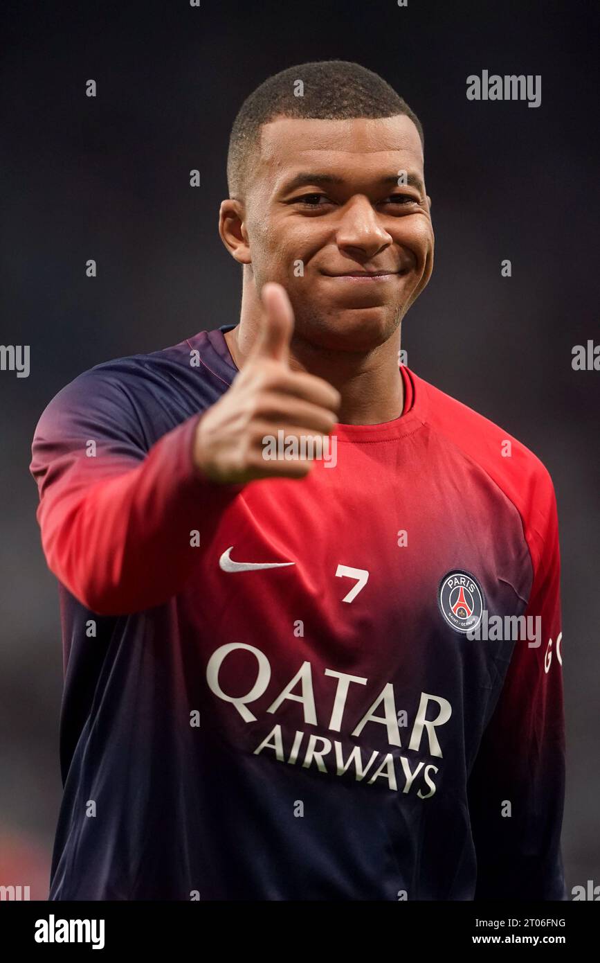 Paris Saint-Germain's Kylian Mbappe gives a thumbs up before the UEFA ...