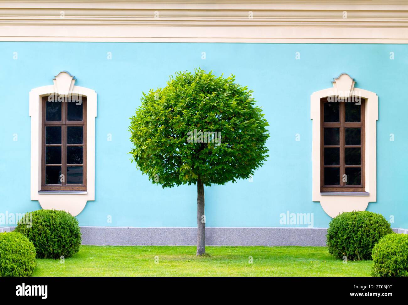 ideal of symmetry, windows, bushes and tree Stock Photo - Alamy