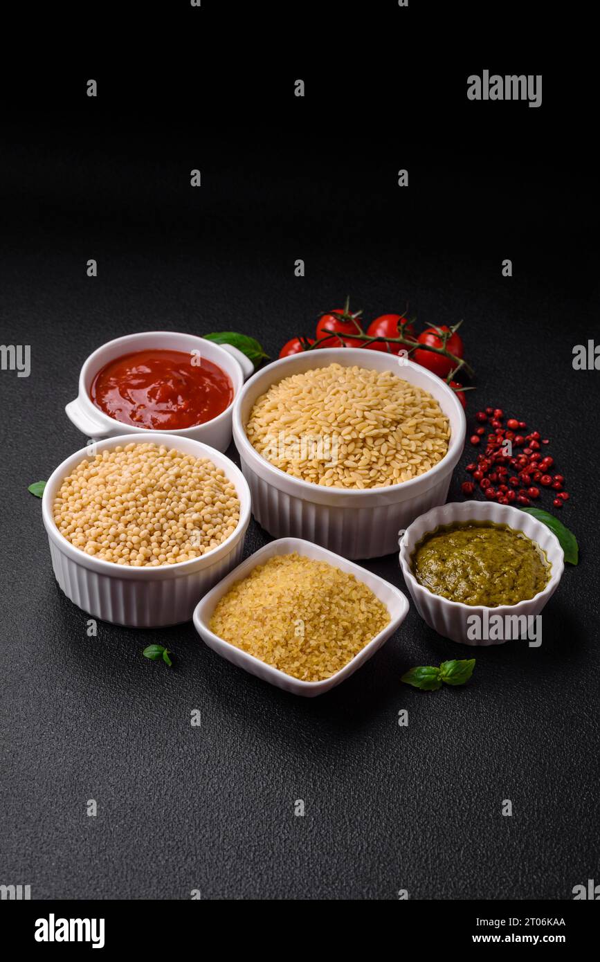 Raw whole grain orzo pasta as an ingredient for a delicious dish ...