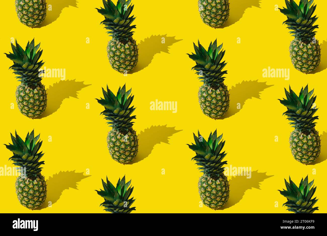 Fresh tropical summer fruit pattern made of pineapple on light yellow ...