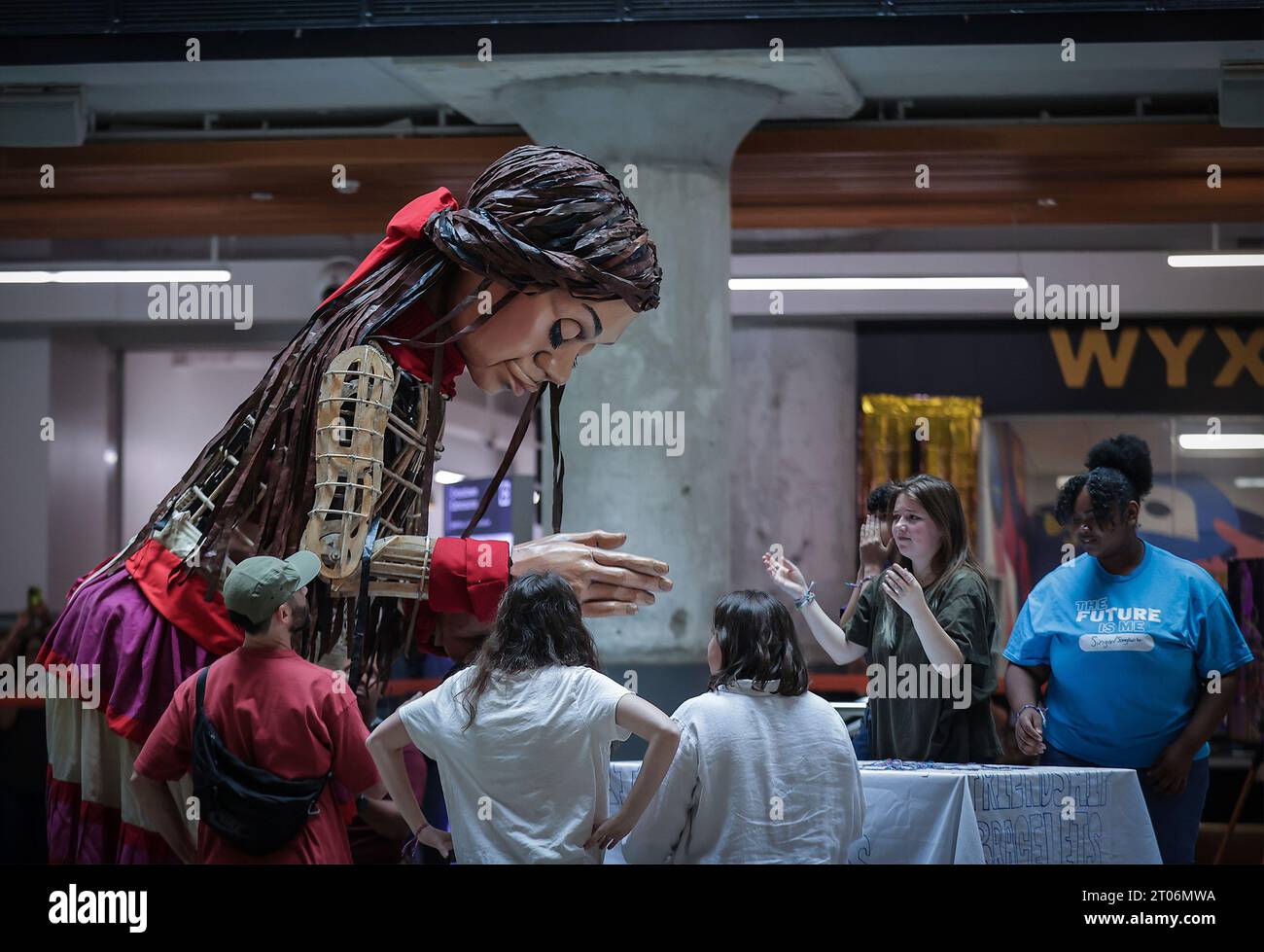 Little Amal, a 12-foot puppet of a Syrian refugee child, acts in a play ...