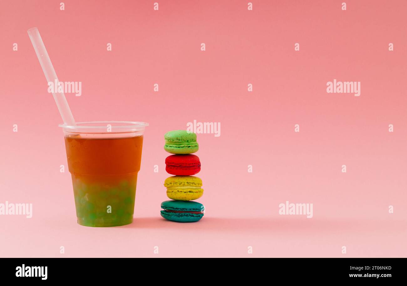 Creative layout made of colorful tasty macarons and fresh bubble tea on ...