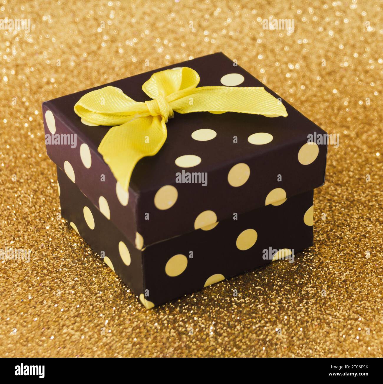 Closeup view minimal composition of Christmas gift box on golden ...