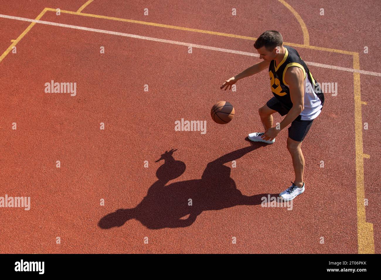 Male sportsman playing basketball throwing ball at playground Stock ...