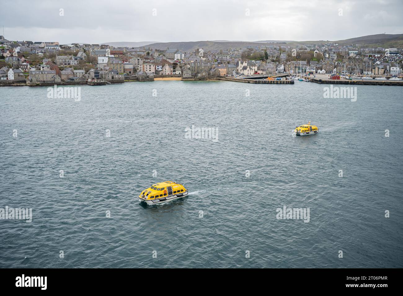 Two yellow lifeboat driving back to AIDA Bella cruise ship, Port of ...