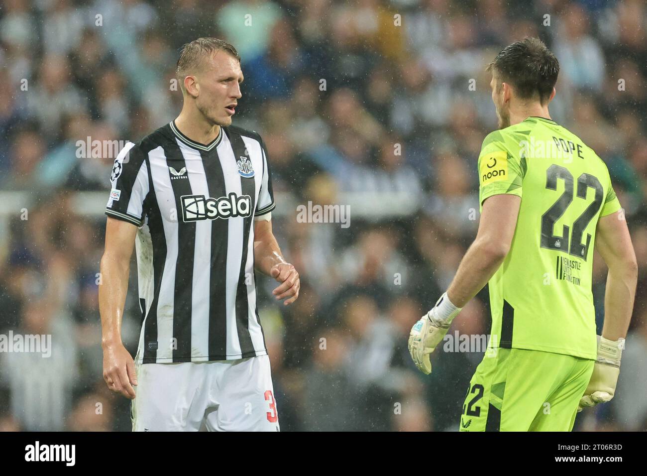Dan Burn #33 of Newcastle United talks with Nick Pope #22 of Newcastle ...