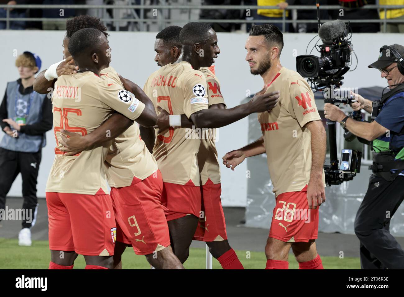 Adrien Thomasson of Lens (R) celebrates his goal with teammates during ...