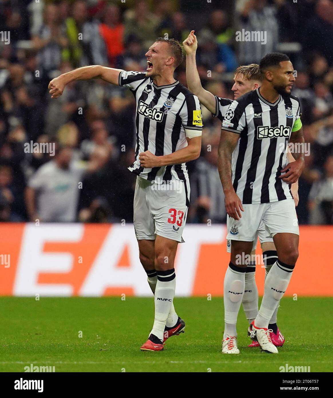 Newcastle United's Dan Burn celebrates scoring their side's second goal ...