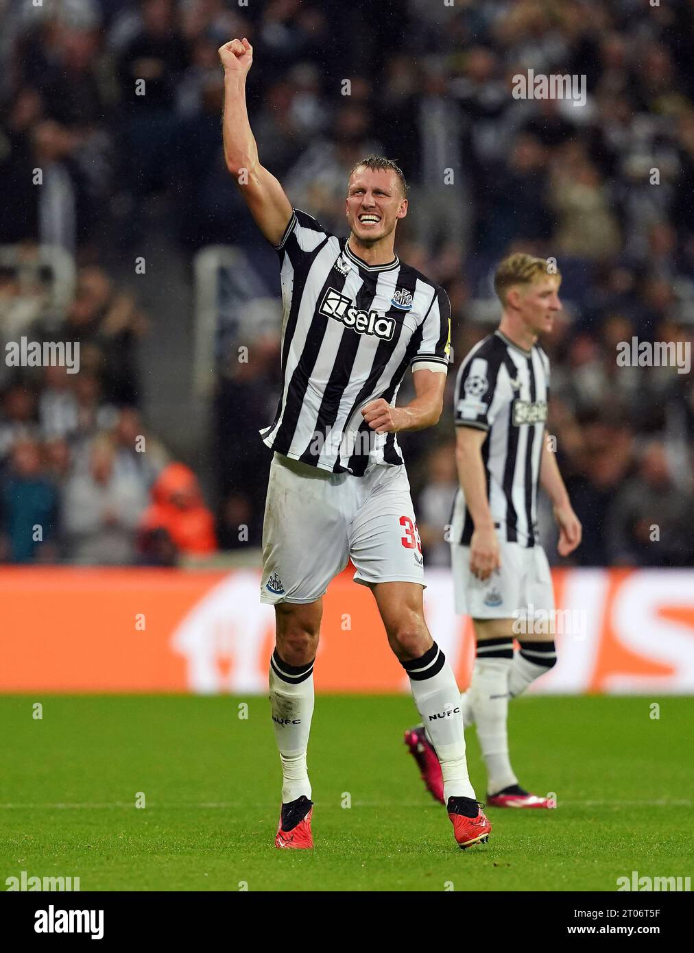 Newcastle United's Dan Burn celebrates scoring their side's second goal ...