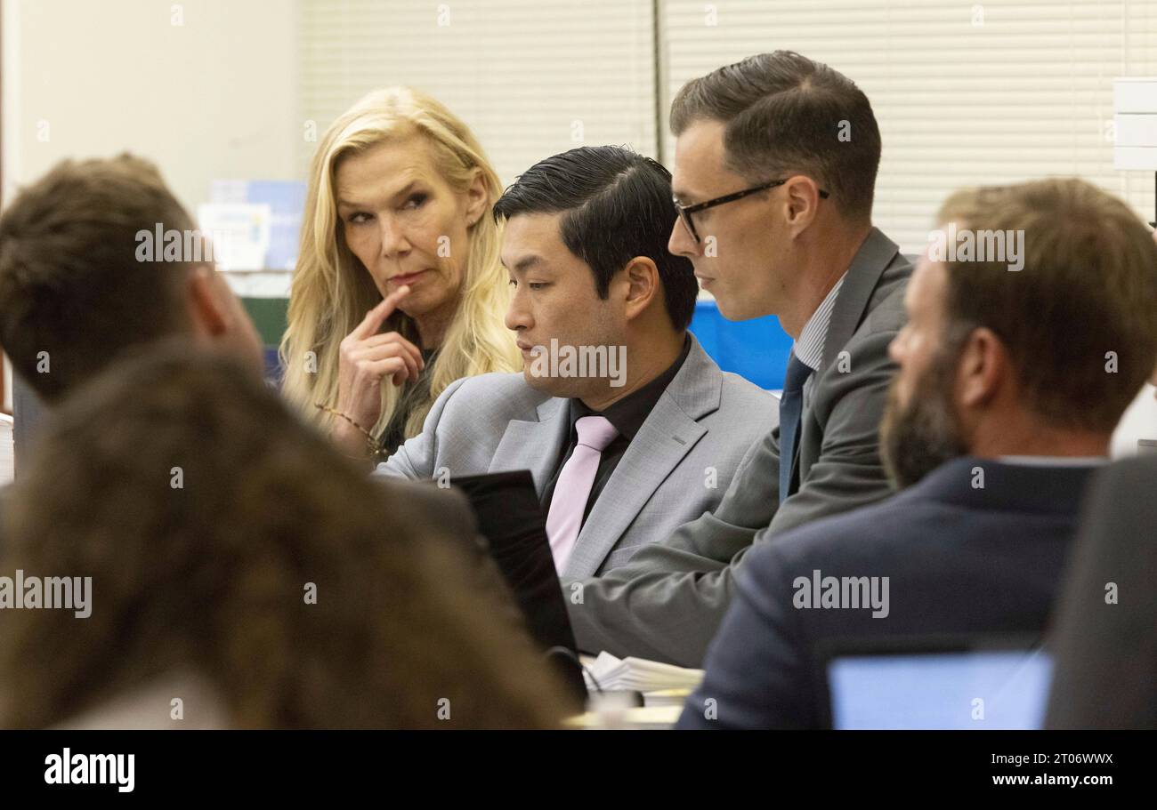Defense attorney Casey Arbenz, left back to camera), defense attorney ...