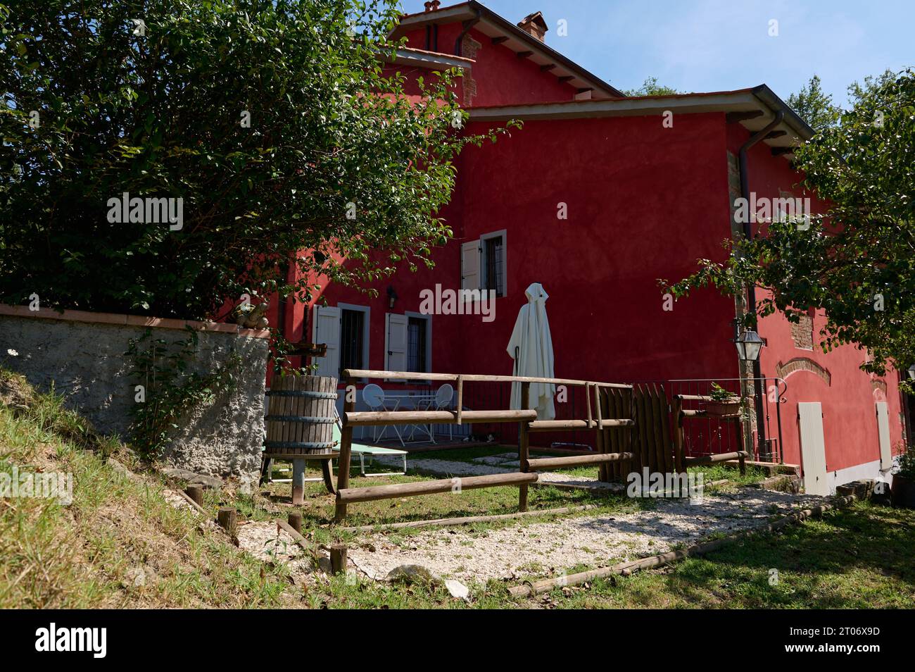 A red country house, Italian hacienda, mansion in the valley in Tuscany ...