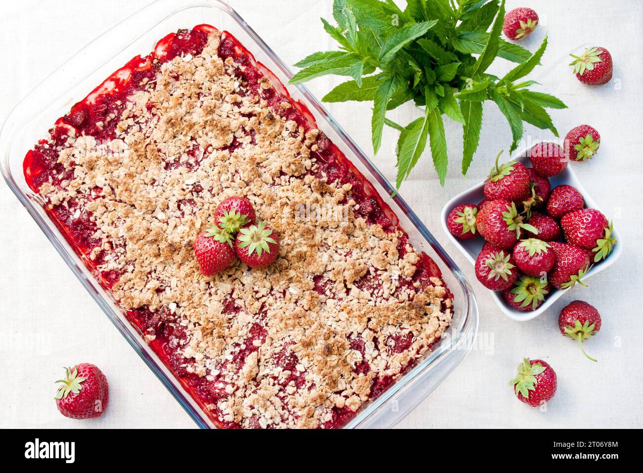 Homemade strawberry crumble is an English dessert. Baked berries ...