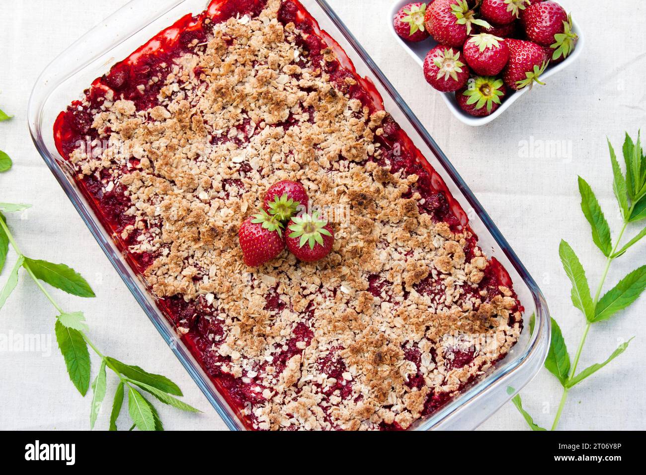 Homemade strawberry crumble is an English dessert. Baked berries ...