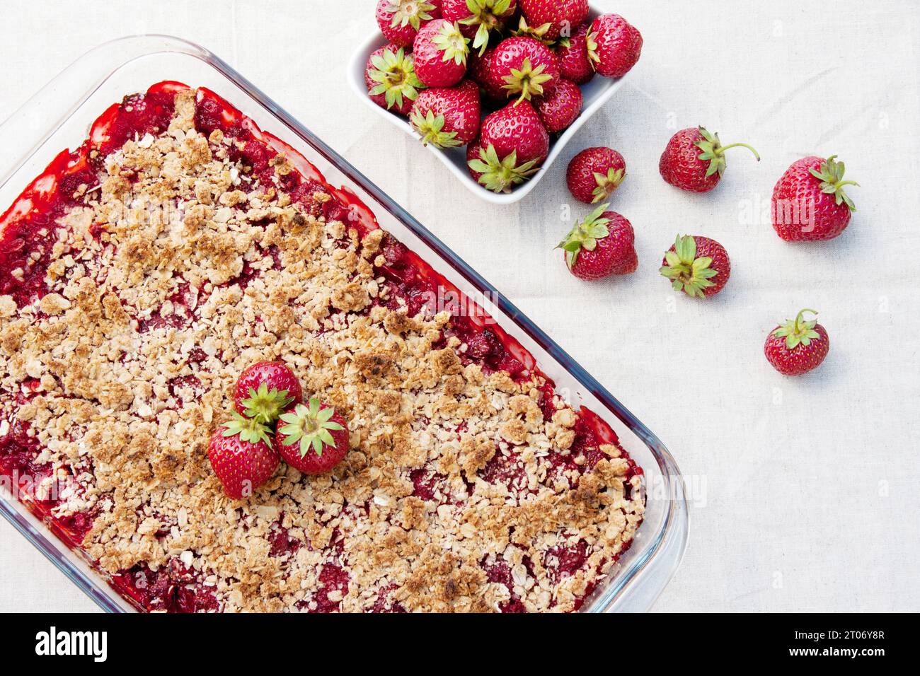 Homemade strawberry crumble is an English dessert. Baked berries ...