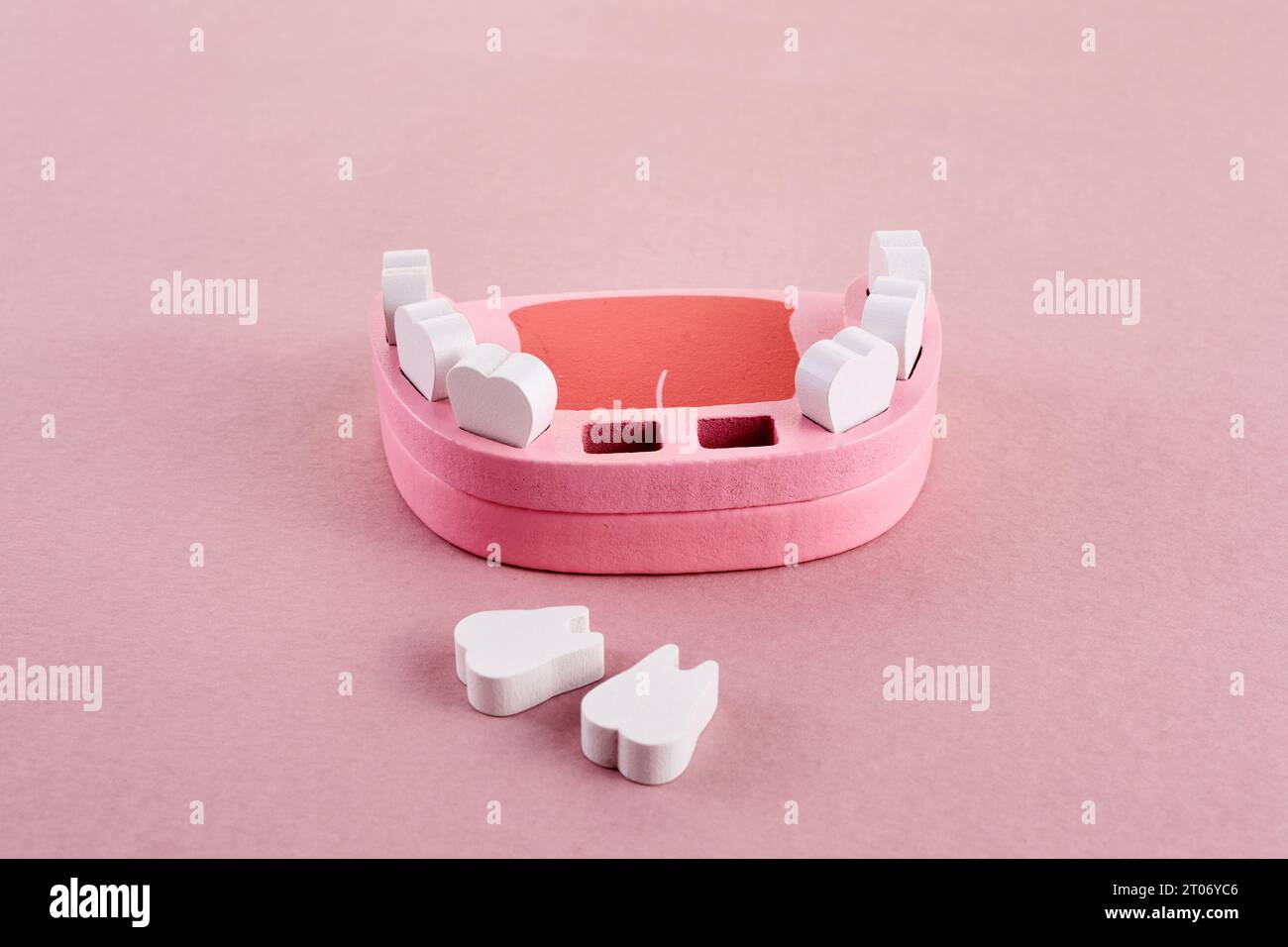 Teeth loss concept. Wooden jaw model with missing or extracted tooth ...