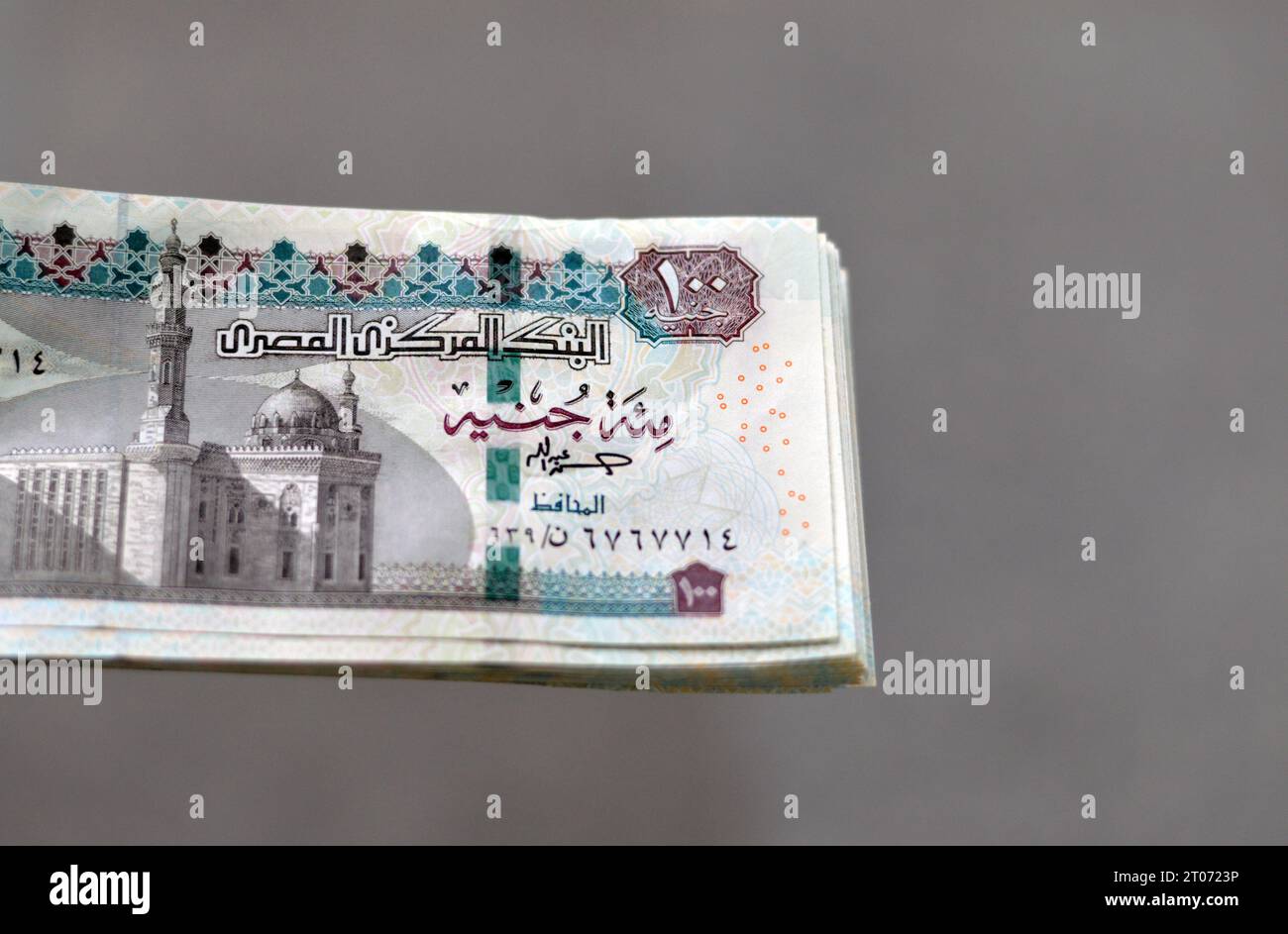 Stack of Egyptian currency of 100 EGP LE 2023 one hundred Egyptian ...
