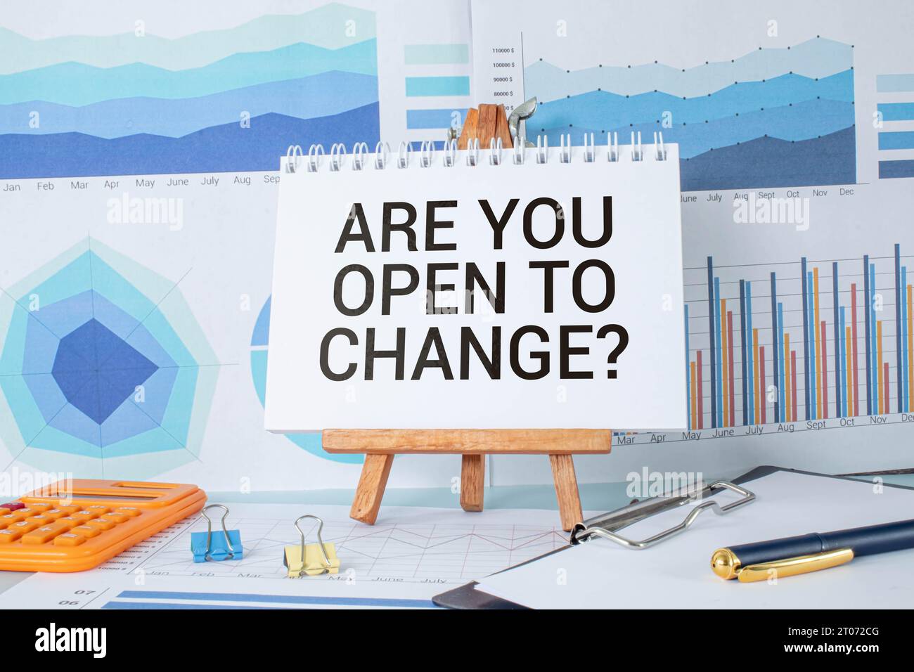 are you open to change. two notepads with text. near bright stationery ...