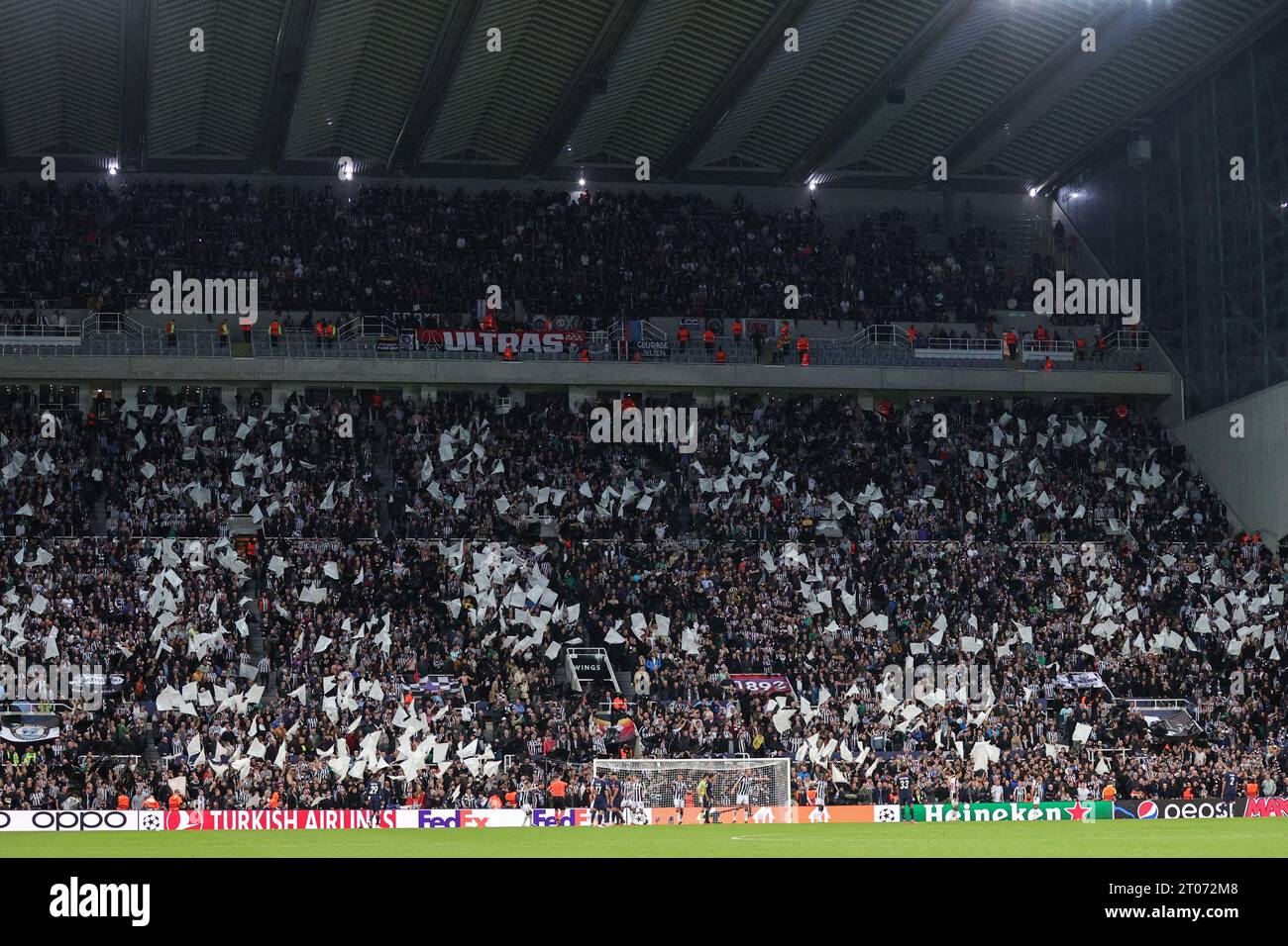 Newcastle United fans wave flags during the UEFA Champions League match ...