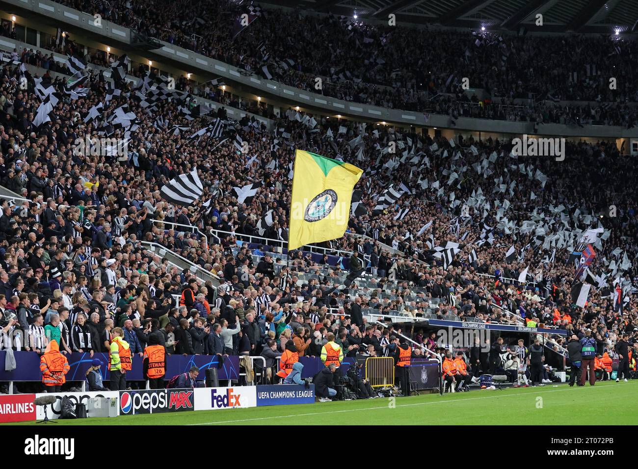 Newcastle United fans wave flags during the UEFA Champions League match ...