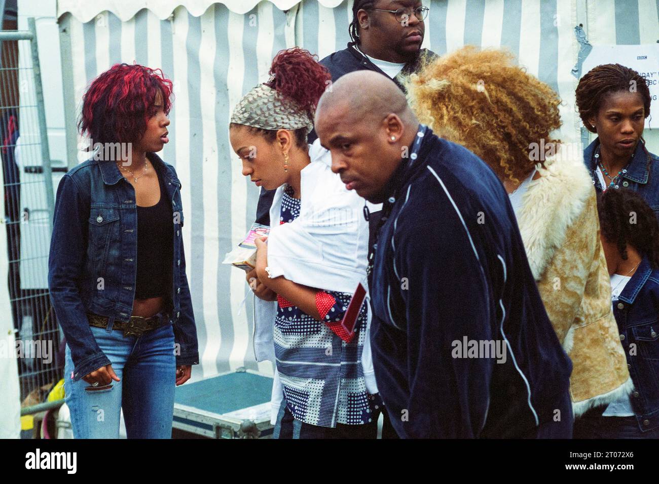 Beyonce Knowles (curly hair hidden) and Kelly Rowland (red hair) of ...