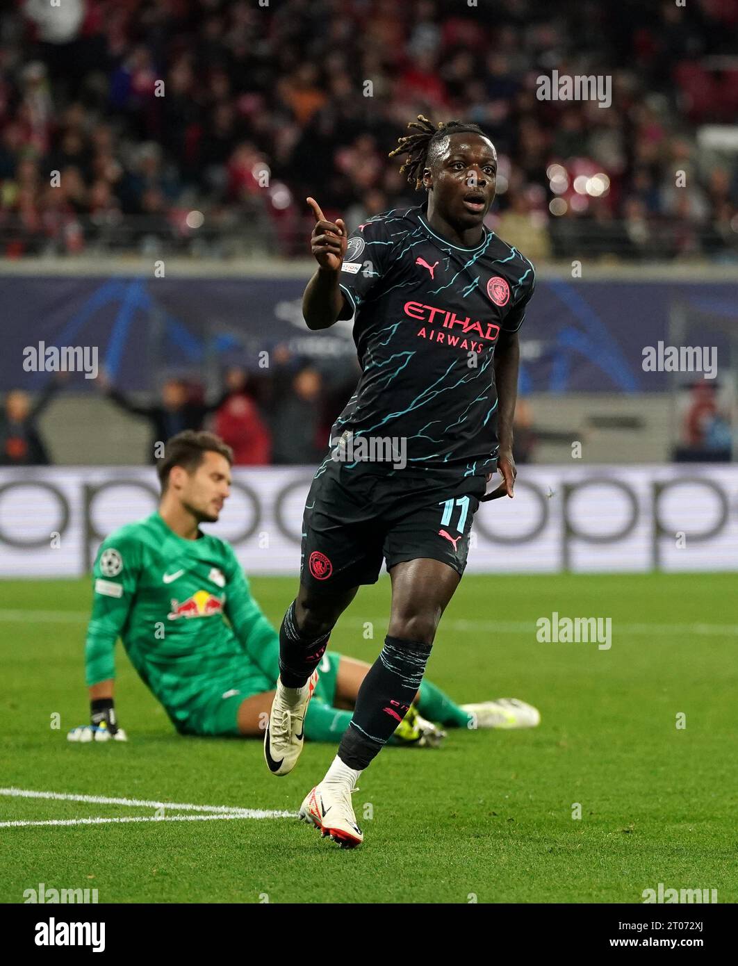 Manchester City's Jeremy Doku celebrates scoring their side's third ...