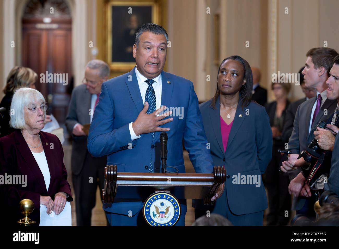 Sen. Alex Padilla, D-Calif., center, flanked by Sen. Patty Murray, D ...