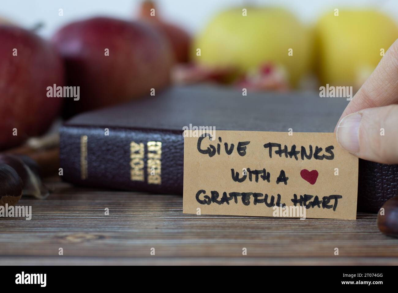 Thanksgiving note with handwritten text "Give thanks with a grateful ...