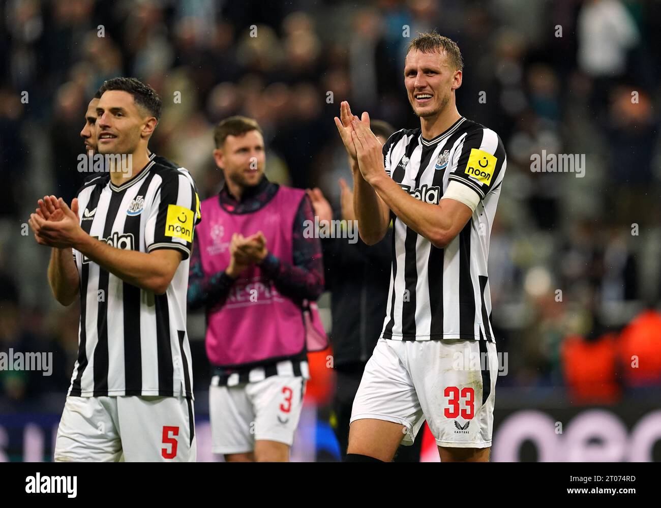 Newcastle United's Dan Burn applauds the fans after the UEFA Champions ...