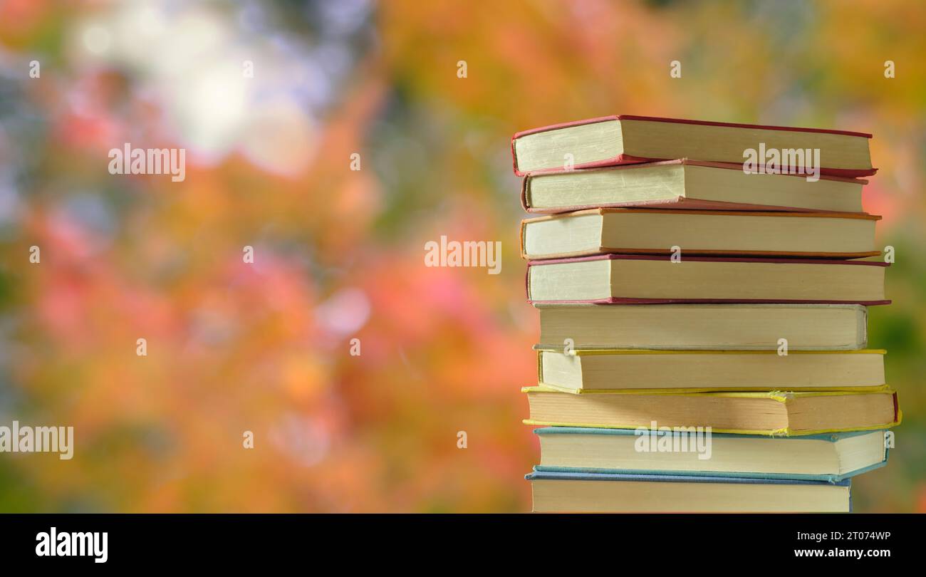 Stack of books with blue sky and clouds background, inspiration ...