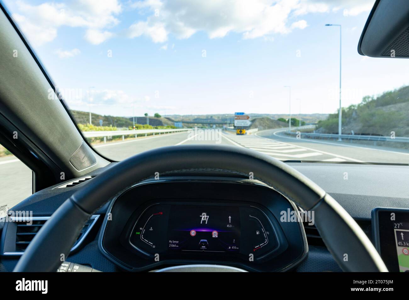 Speedometer in the car on the dashboard. The car's speedometer shows 77 ...