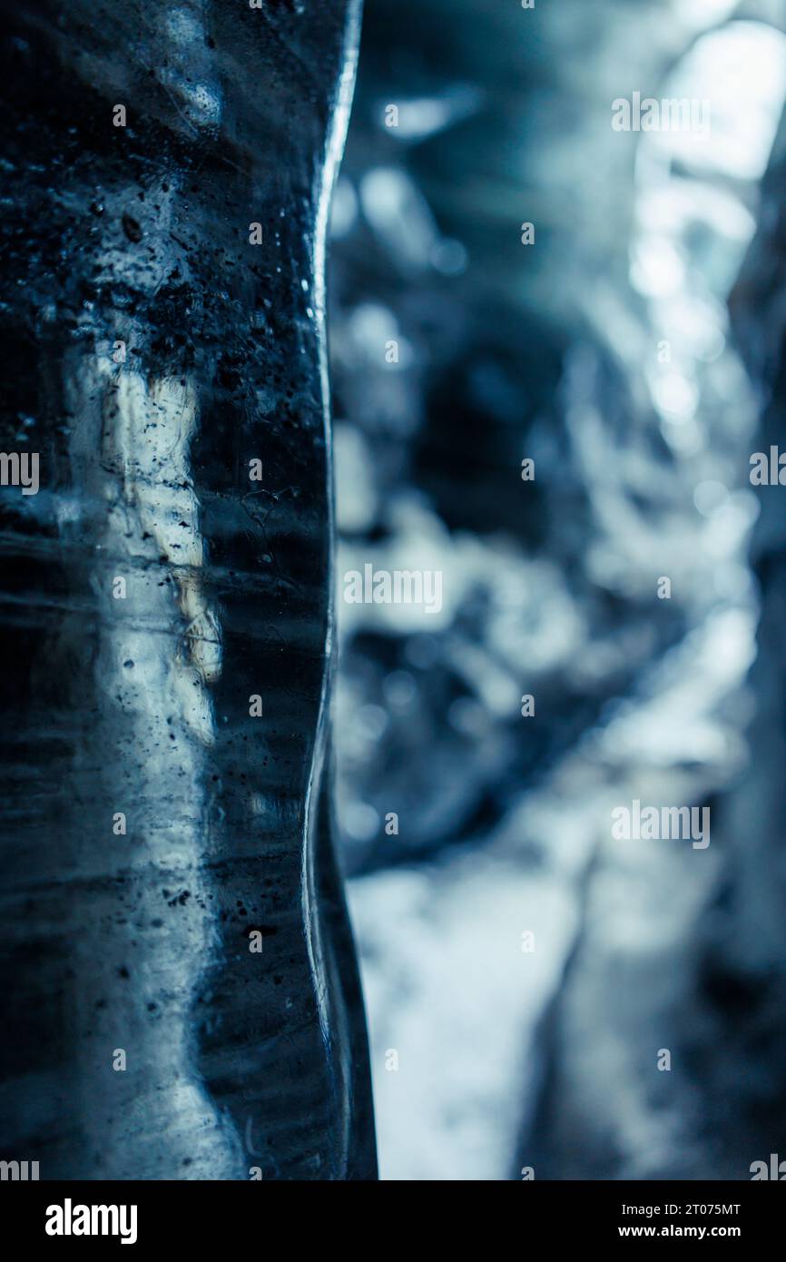 Water dripping from ice rocks in cave, climate change concept. Massive ...