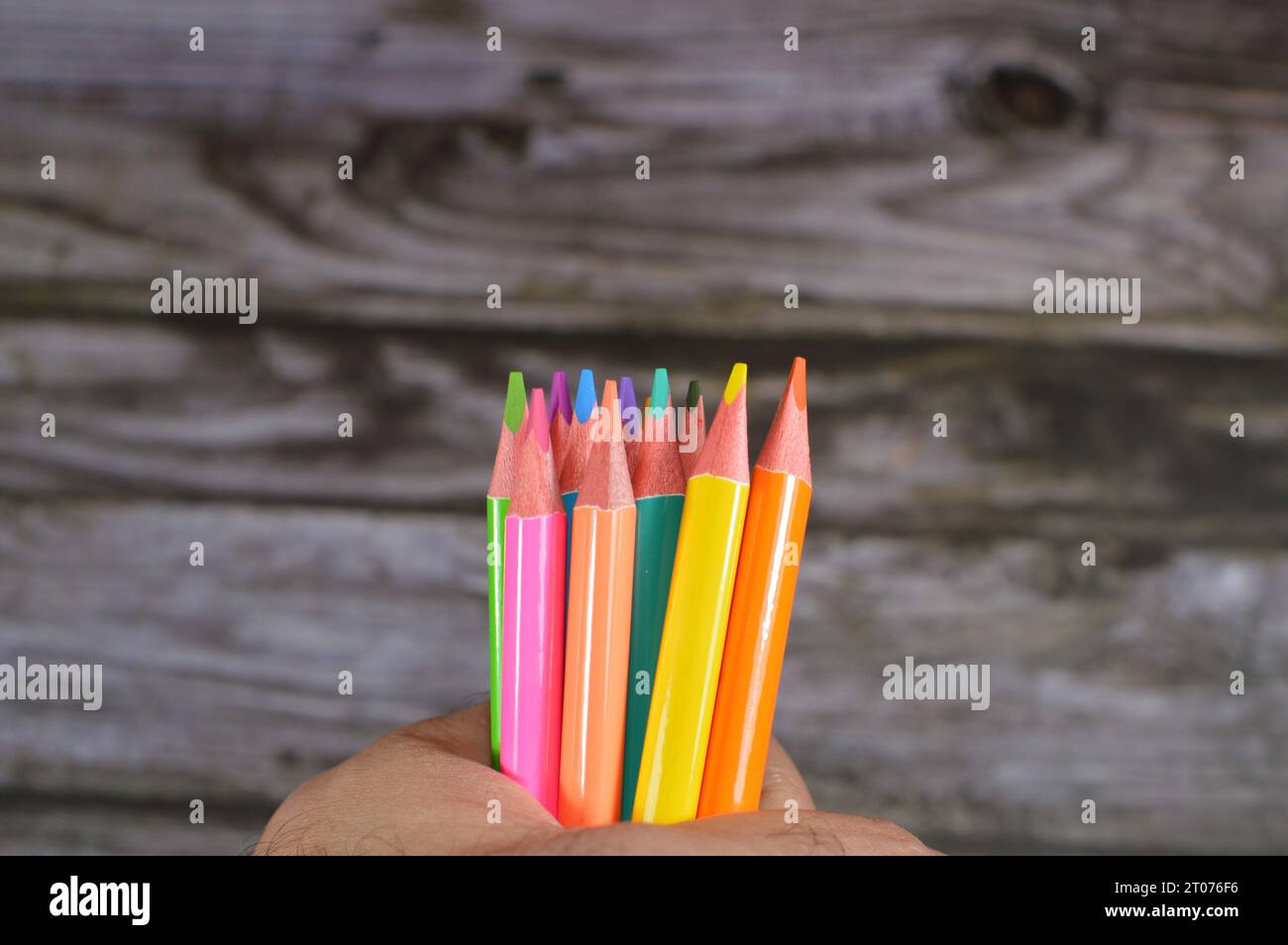 wood color pencils of different colors for painting isolated on wooden ...