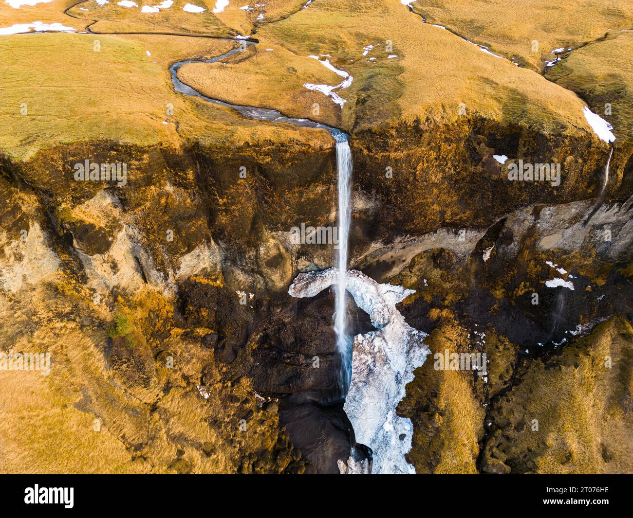 Drone shot of Foss a Sidu cascade in Iceland, gushing from edge and ...