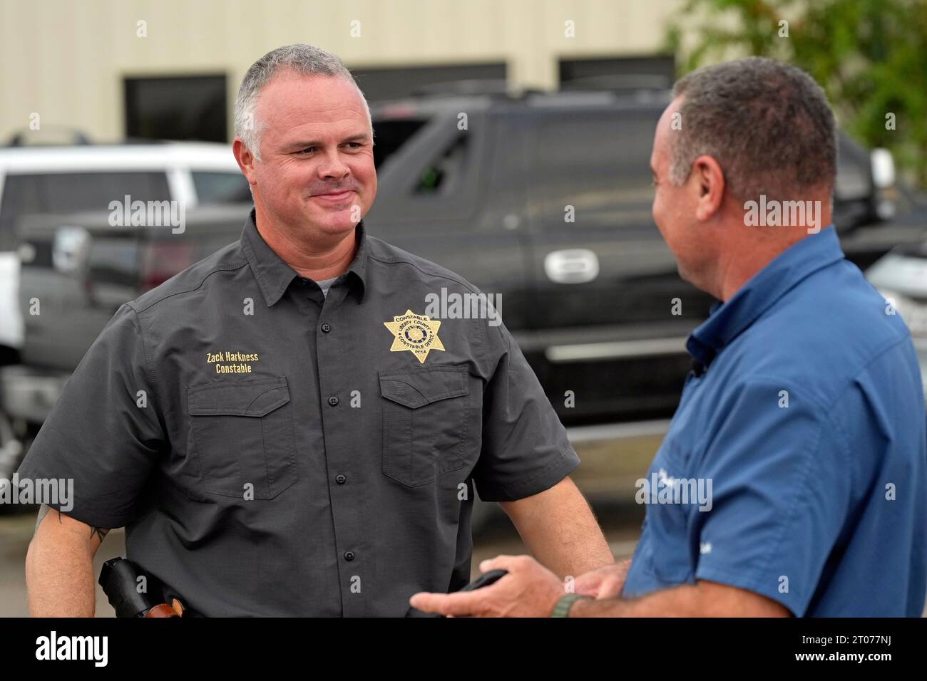 Liberty County Precinct 6 Constable Zack Harkness, left, talks with ...