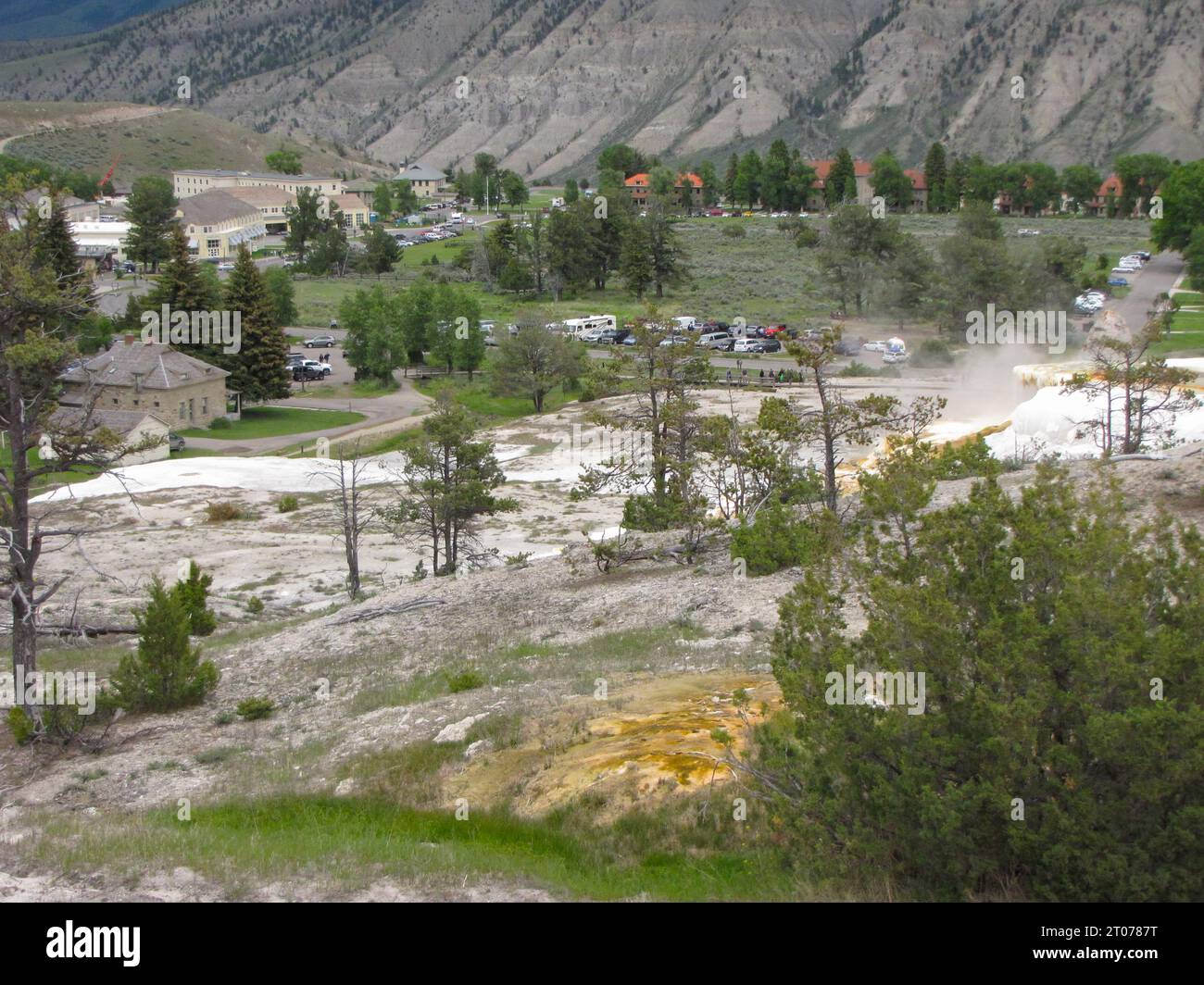 View of the parking area from atop the terraces at Mammoth Hot Springs ...