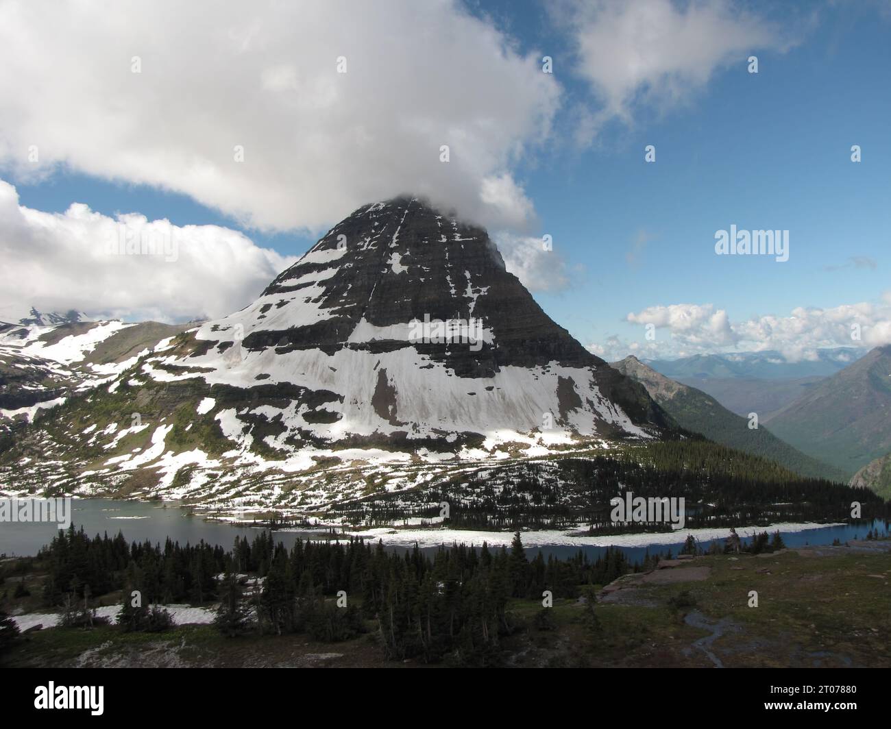 Grand view of a snow-covered Mount Bearhat and Hidden Lake in the Logan ...
