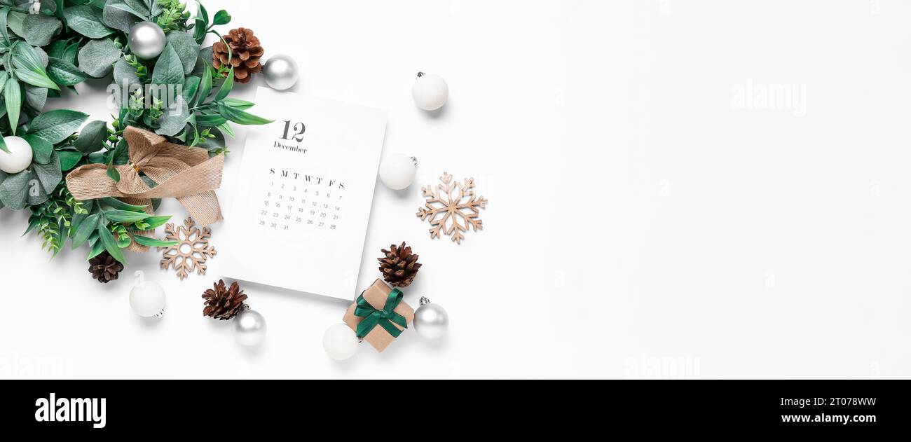 Paper calendar for December 12 with mistletoe wreath, gift and ...