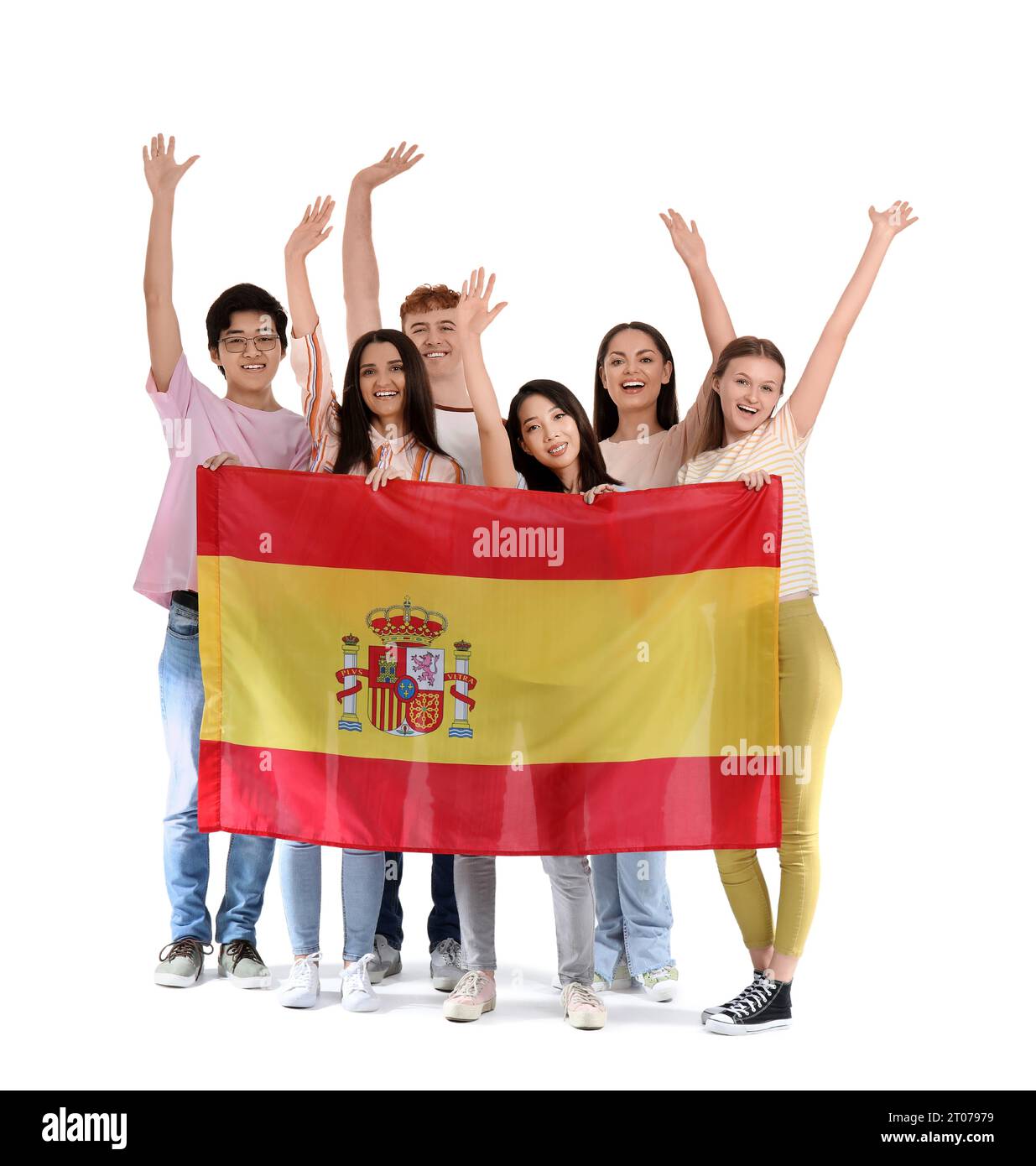 Young students of language school with Spanish flag on white background ...