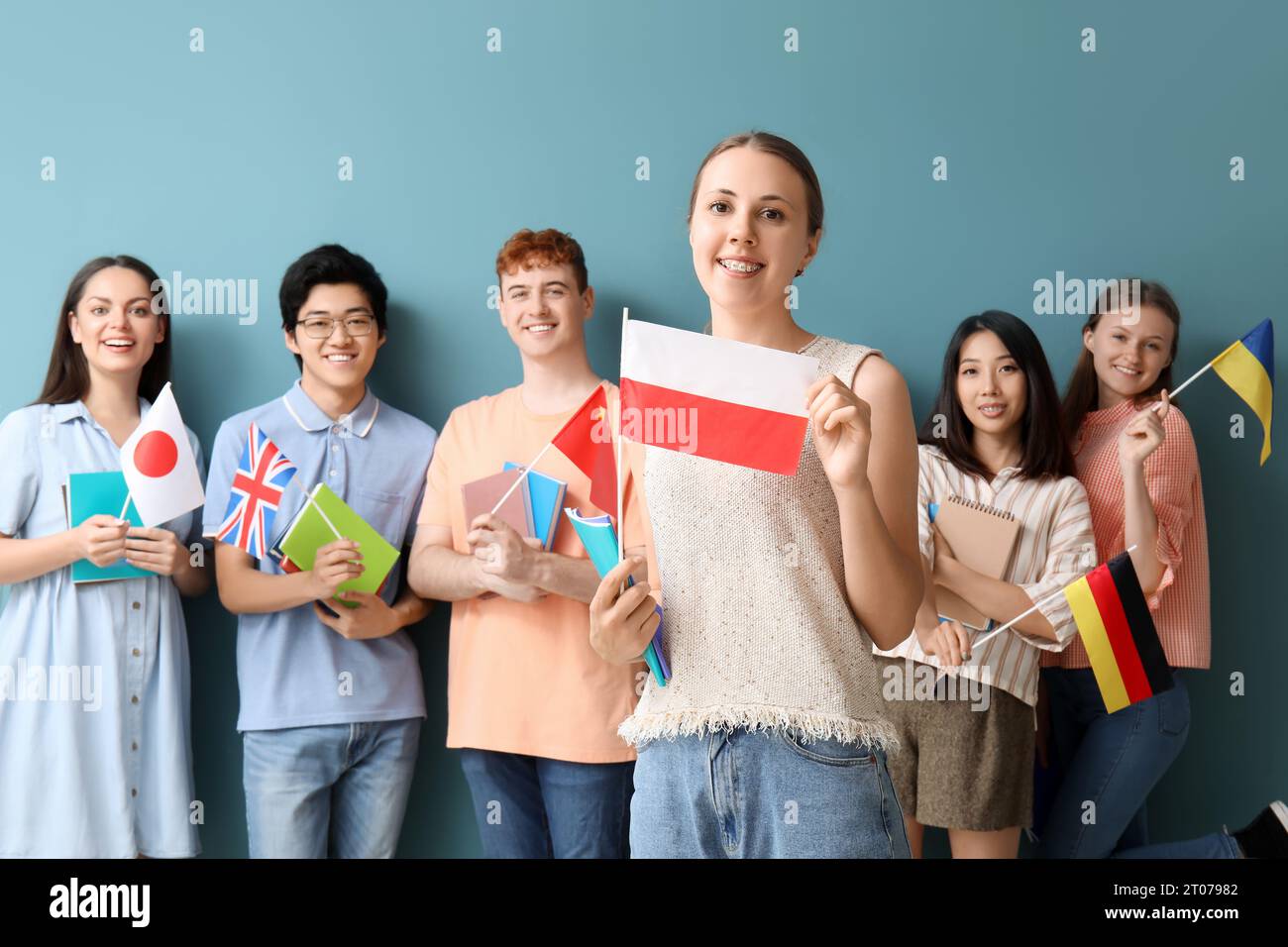 Young students of language school with flags on blue background Stock ...